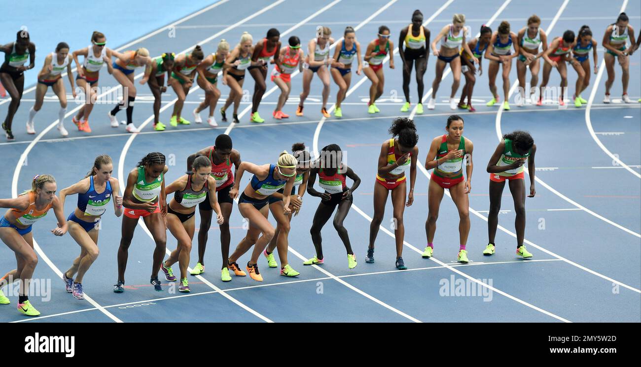 Athletes line up for the women's 10,000-meter final during the ...