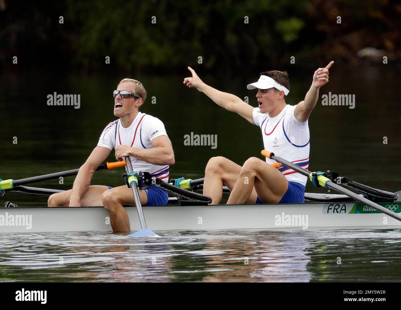 Pierre Houin and Jeremie Azou ,of France, top, celebrates winning gold ...