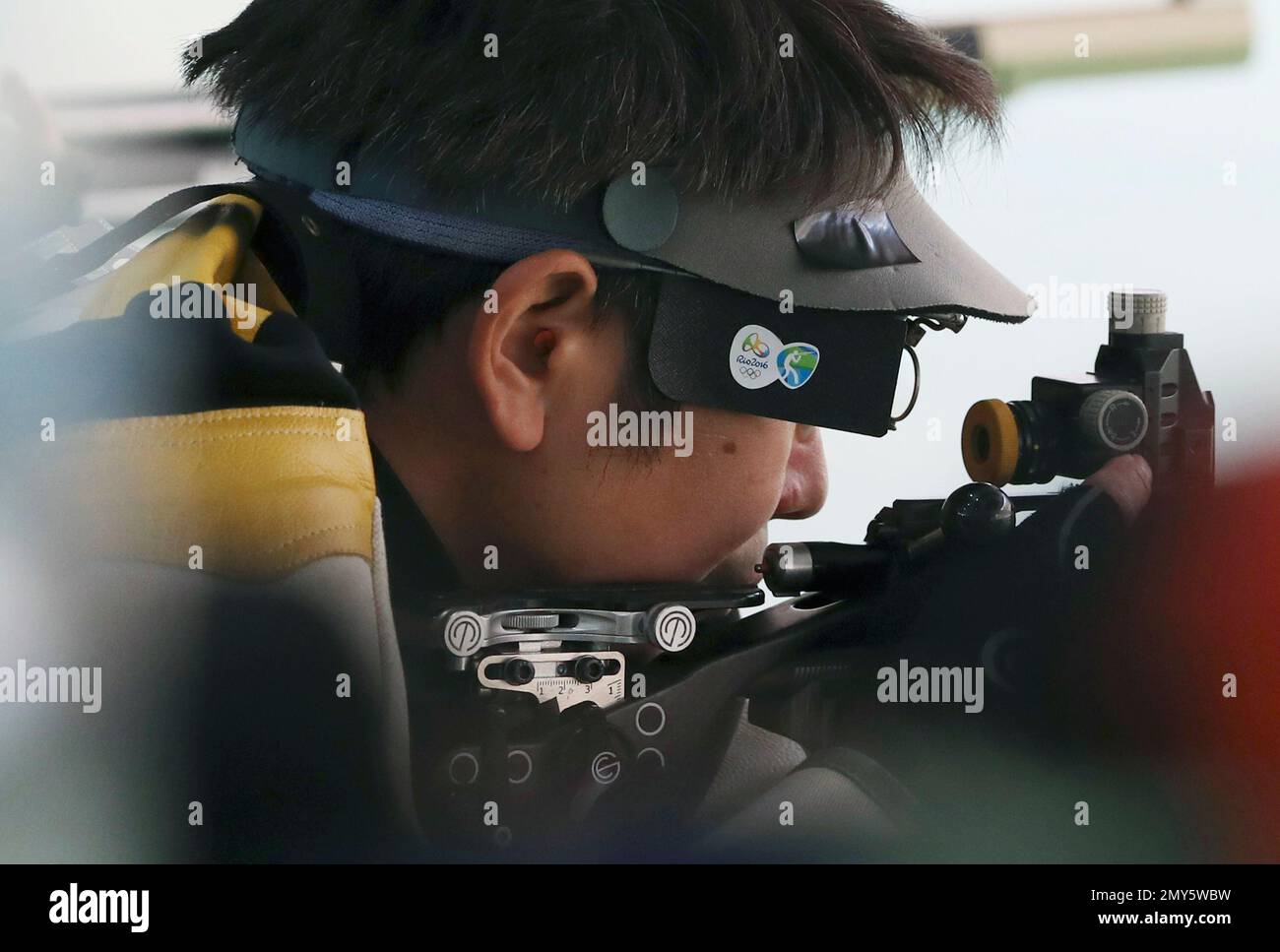 Toshikazu Yamashita of Japan aims his gun during the men's 50 meter ...