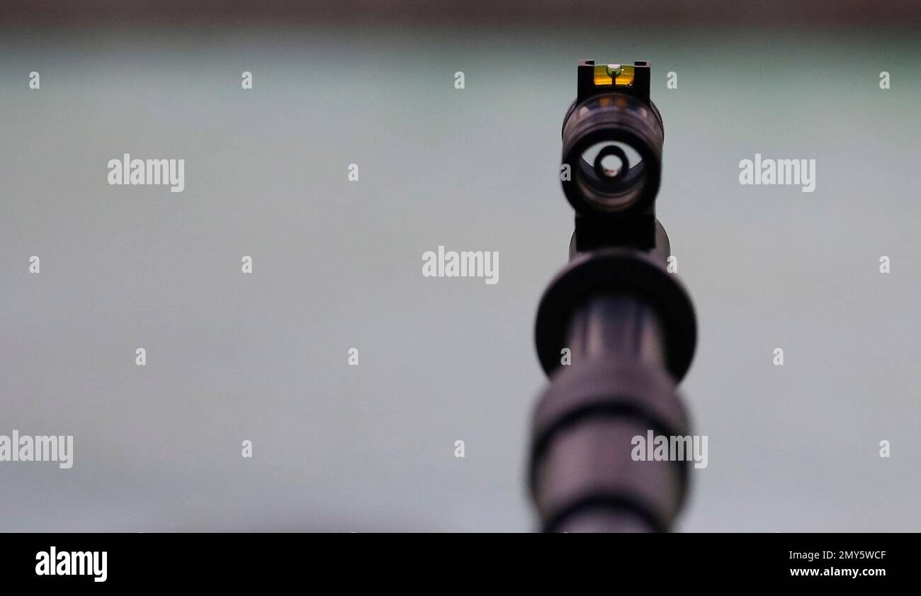 Toshikazu Yamashita of Japan aims his gun during the men's 50 meter ...