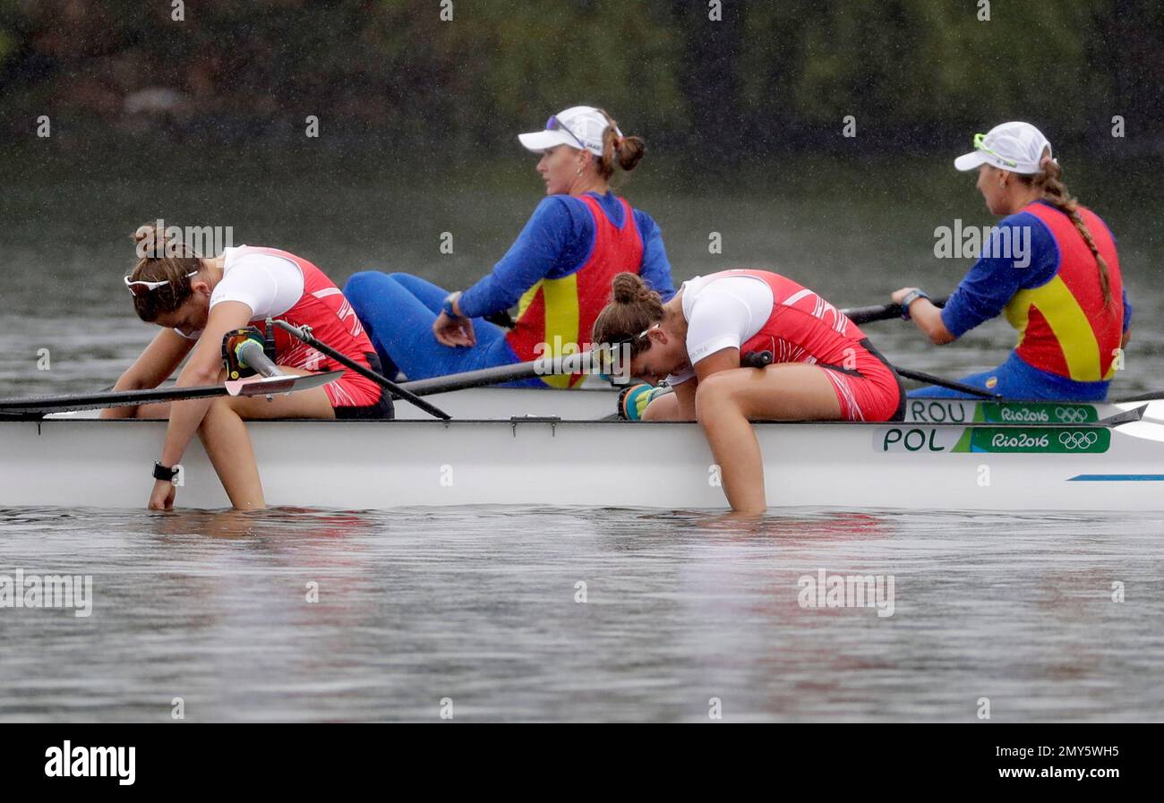 Anna Wierzbowska, and Maria Wierzbowska, of Poland, rest after ...