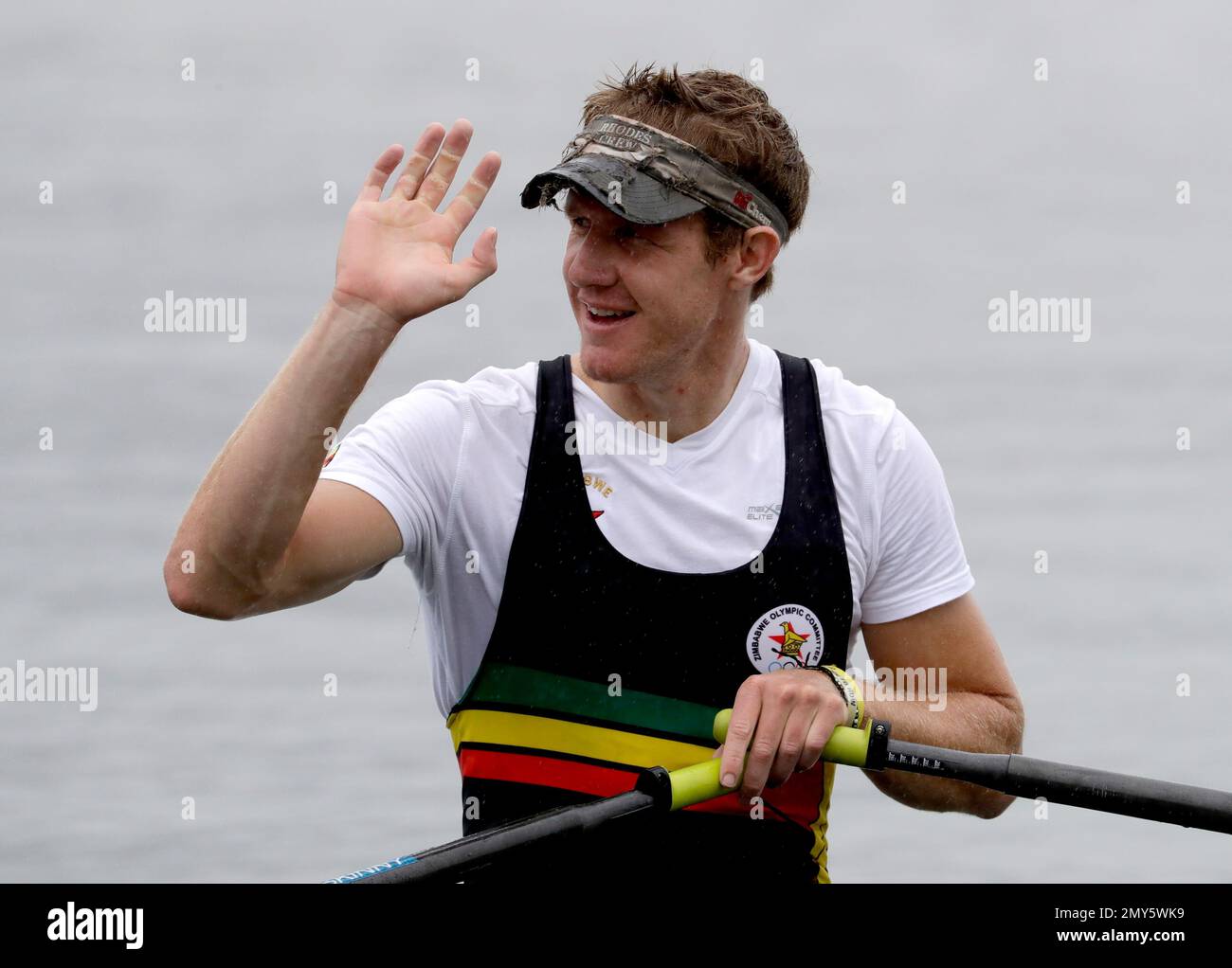 Andrew Graham Peebles waves to fans after competing in the men's rowing ...