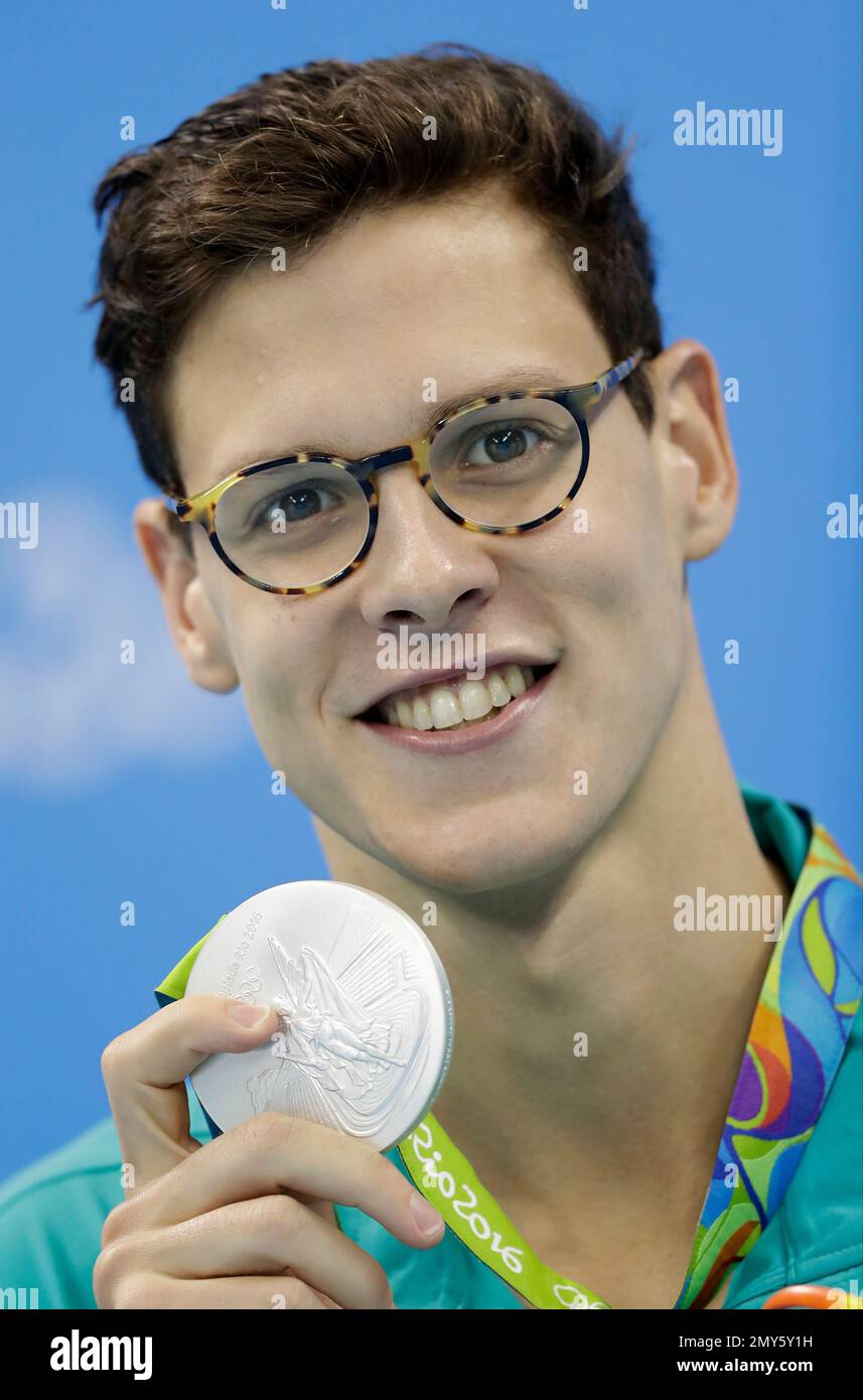 Australia's Mitch Larkin shows off his silver medal during the medal ...
