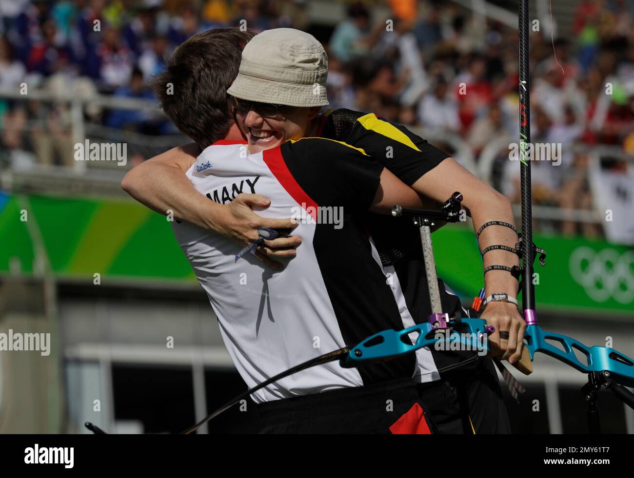 Germany's Lisa Unruh celebrates with her coach after winning an ...