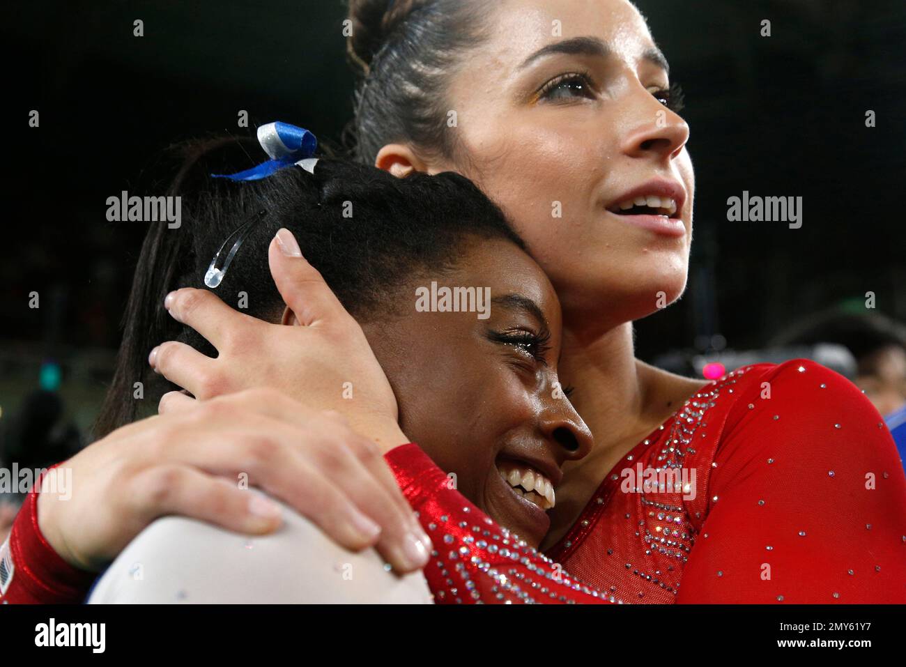 United States' Aly Raisman embraces compatriot Simone Biles after their ...