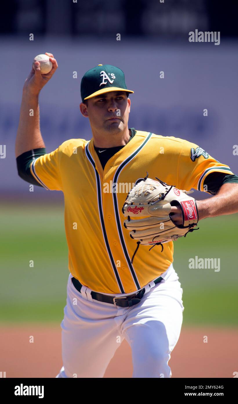 Oakland Athletics pitcher Andrew Triggs delivers against the Baltimore ...