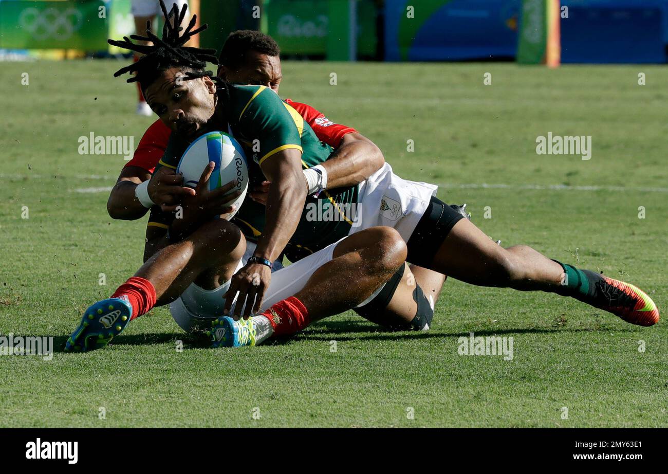 South Africa's Rosko Specman, front, is tackled by Britain's Daniel Bibby, during the semi final ...