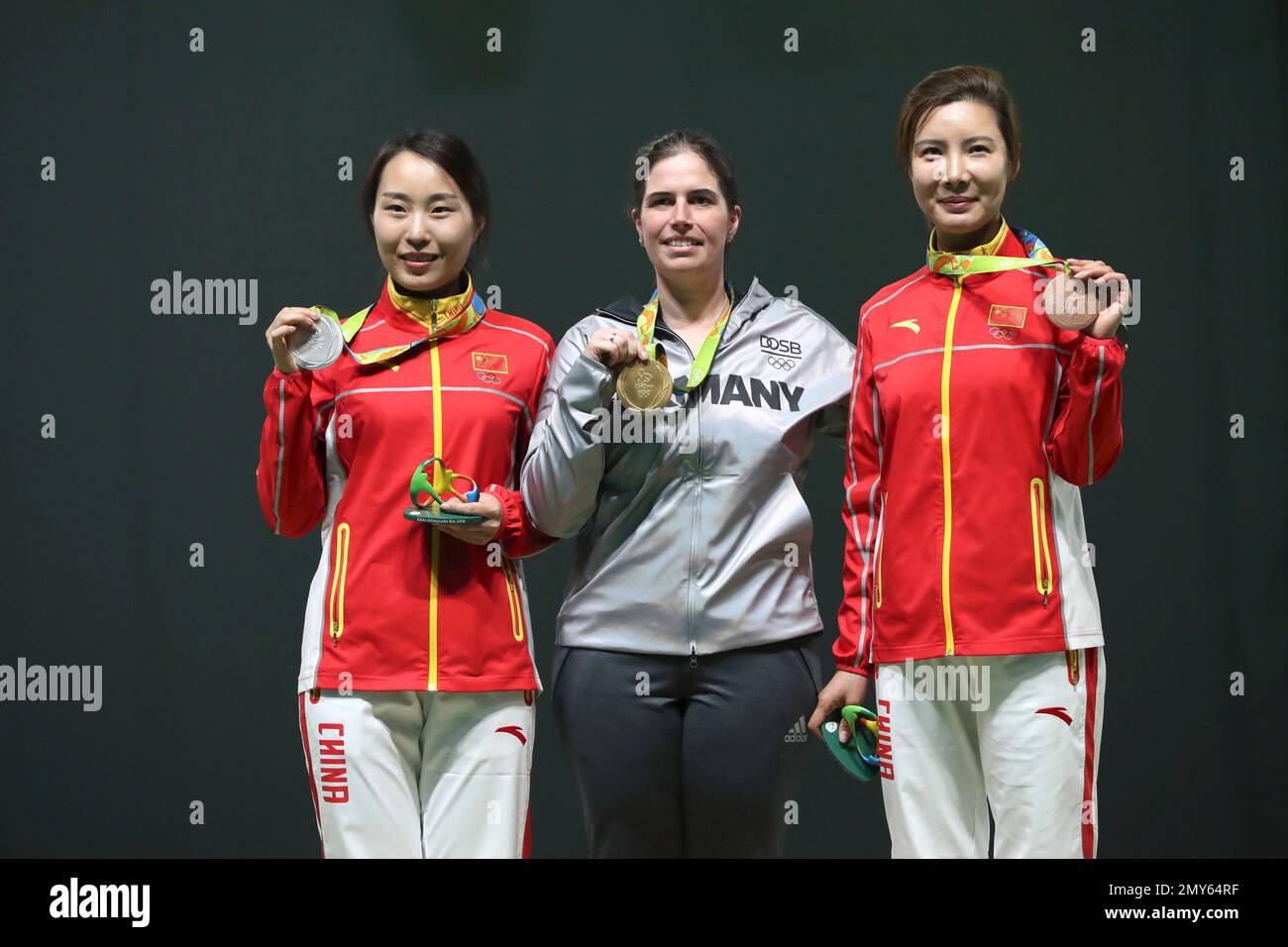 Gold medalist Barbara Engleder, center, of Germany is flanked by silver ...