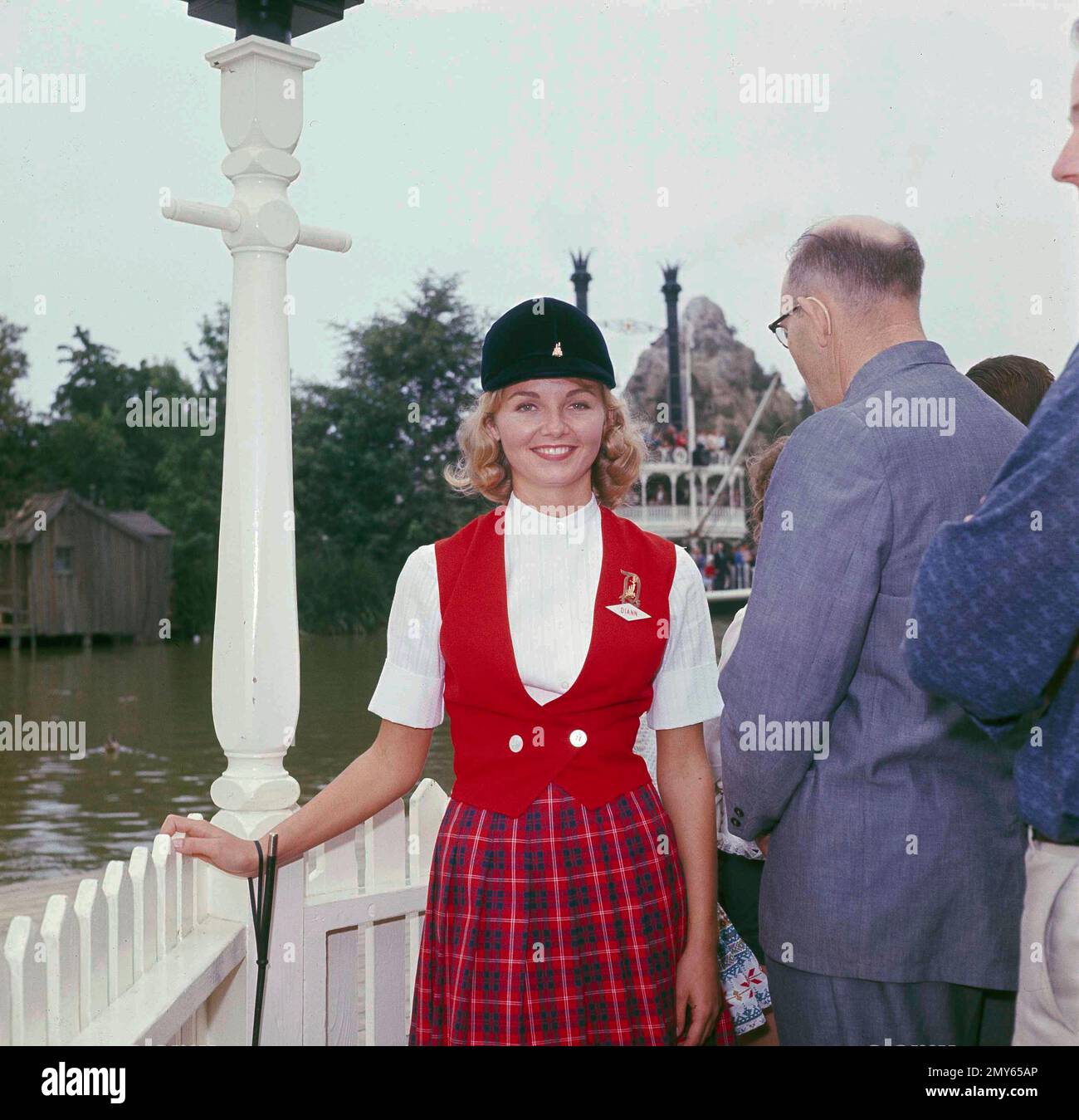 Disneyland guide, Diane Stewart, poses for a photo in front of the Mark ...