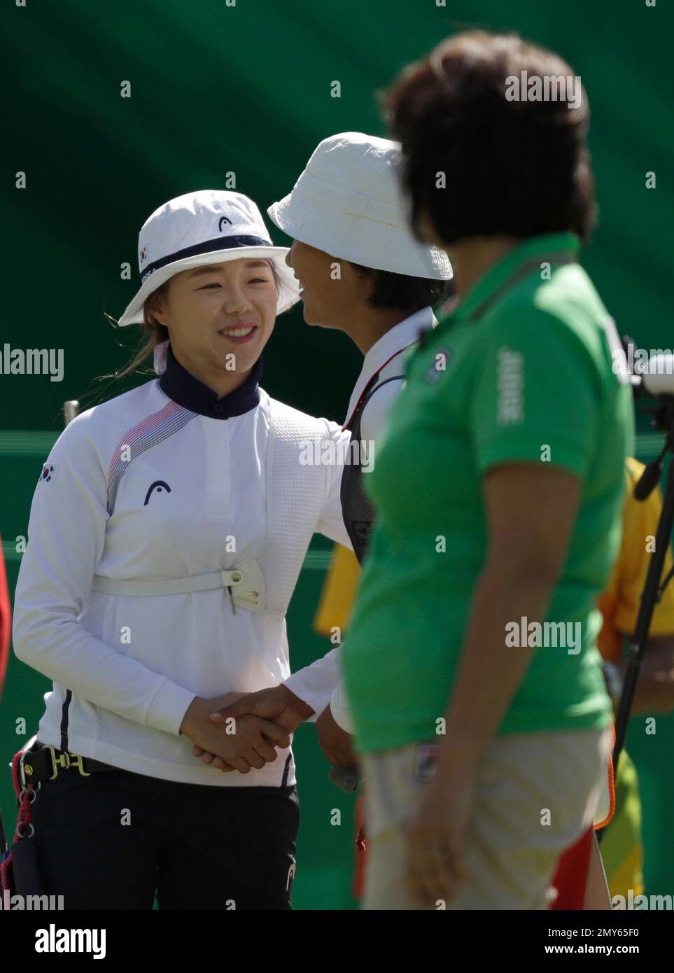 South Korea's Chang Hye-jin, left, shakes hand with North Korea's Kang ...