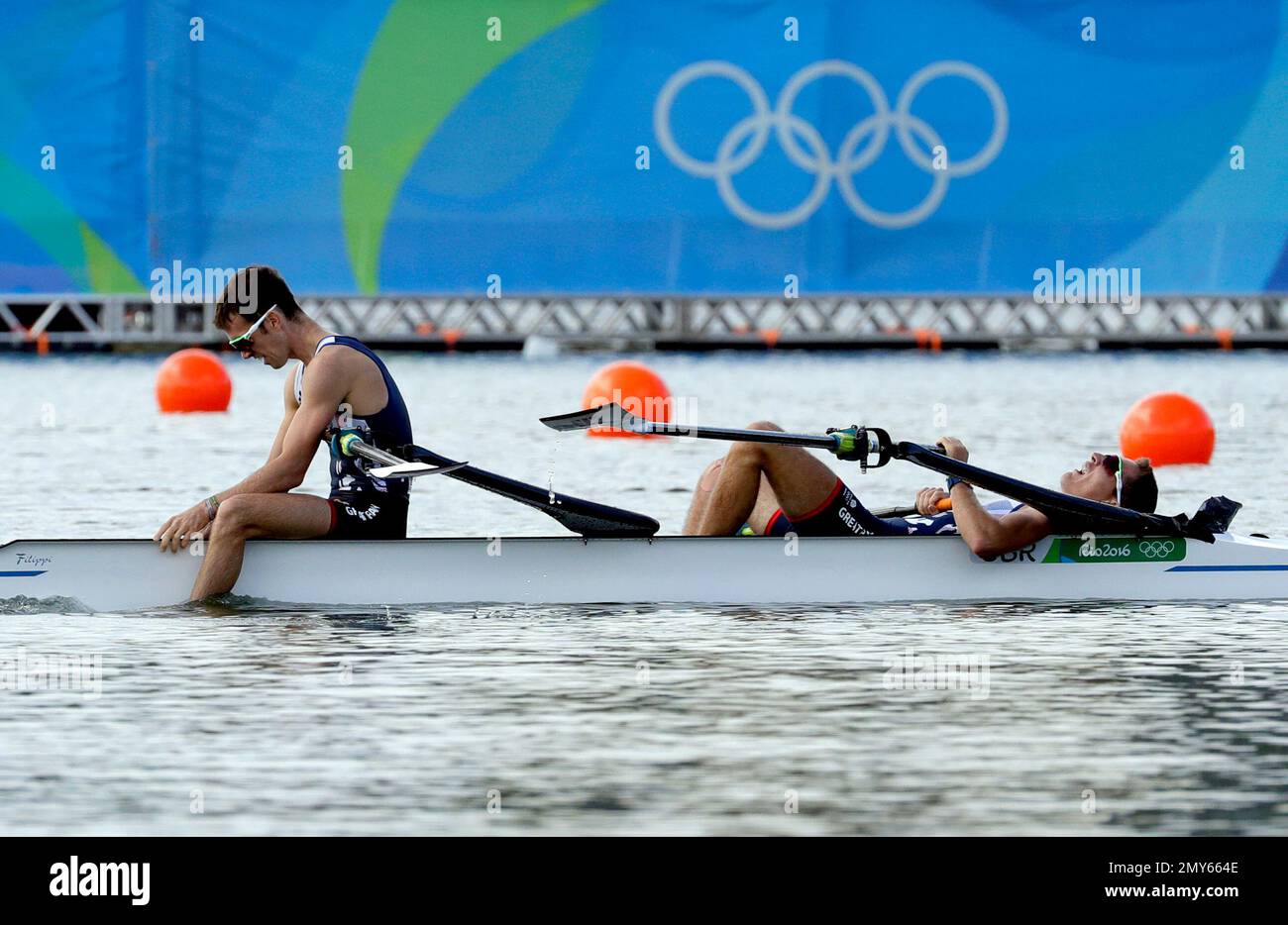 Will Fletcher and Richard Chambers, of Britain, rest after competing in ...