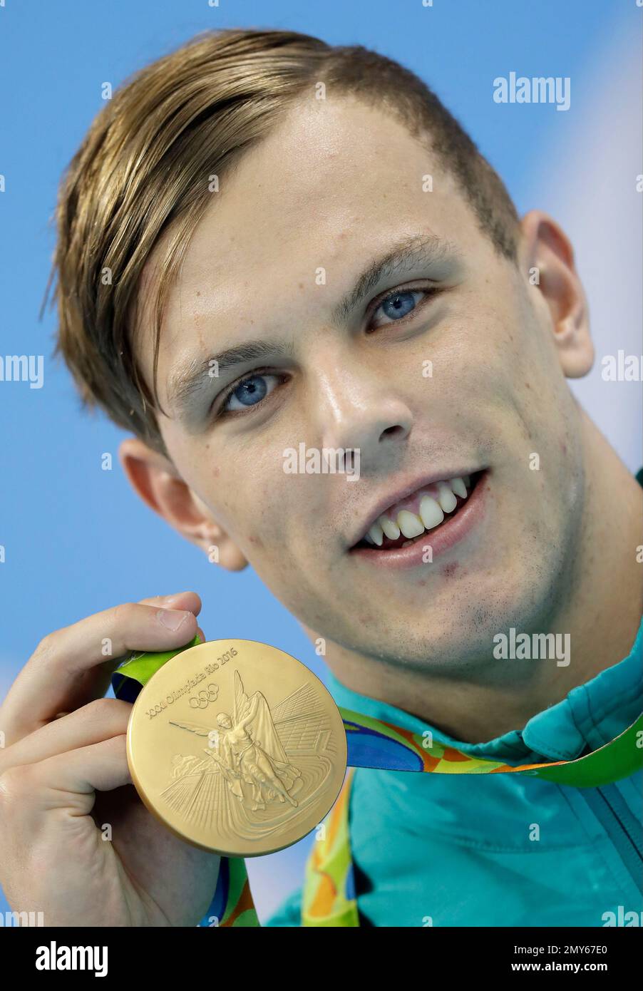 Australia's Kyle Chalmers shows off his gold medal during the men's 100 ...