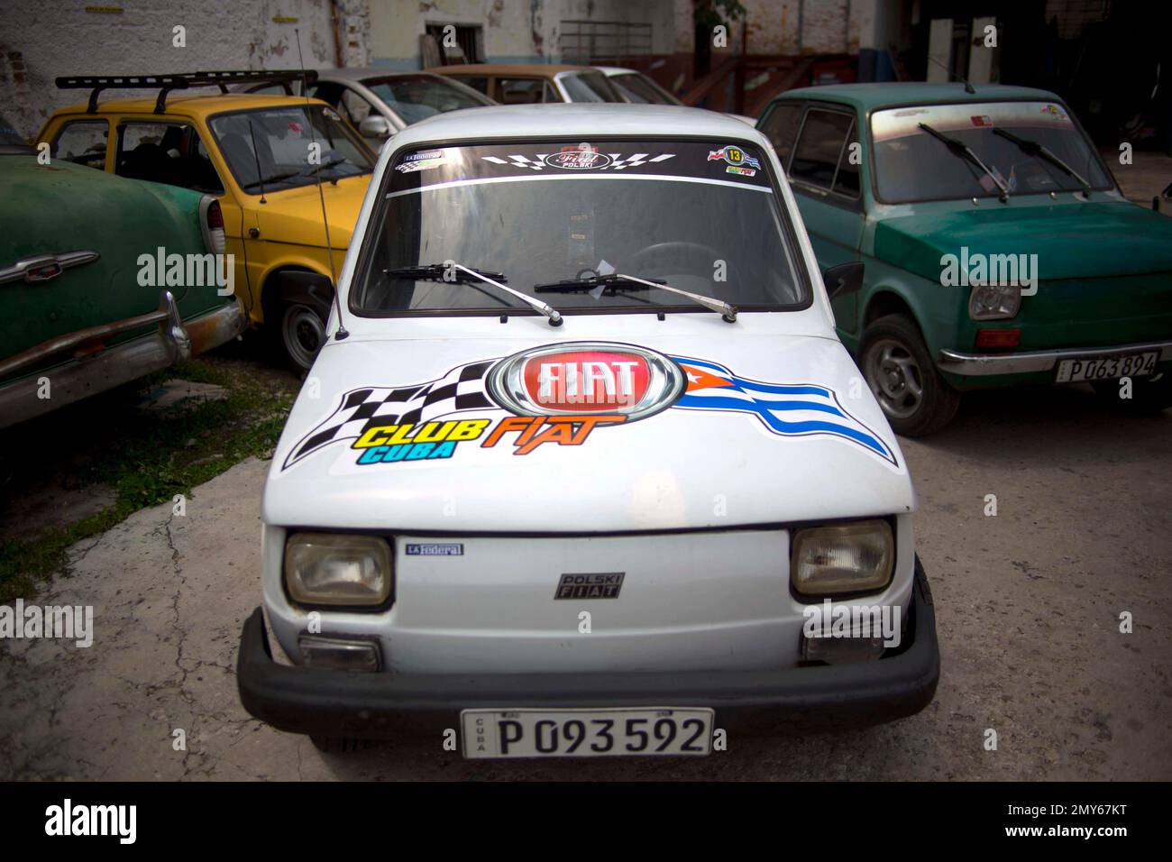 Fiat Polski 126p's from the Club Fiat Cuba, stand in a garage in Havana ...