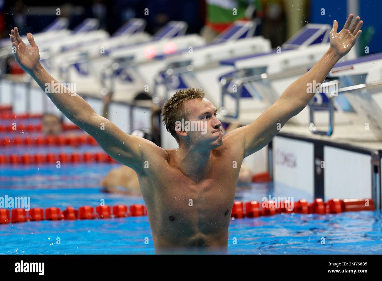 Kazakhstan's Dmitriy Balandin celebrates after winning the gold medal ...