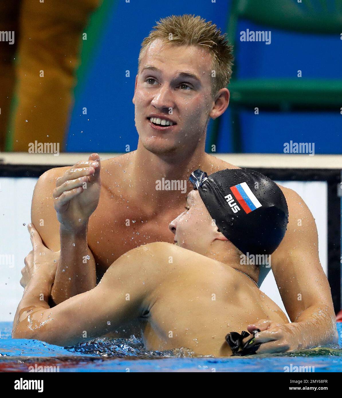Kazakhstan's Dmitriy Balandin is congratulated by Russia's bronze medal winner Anton Chupkov ...