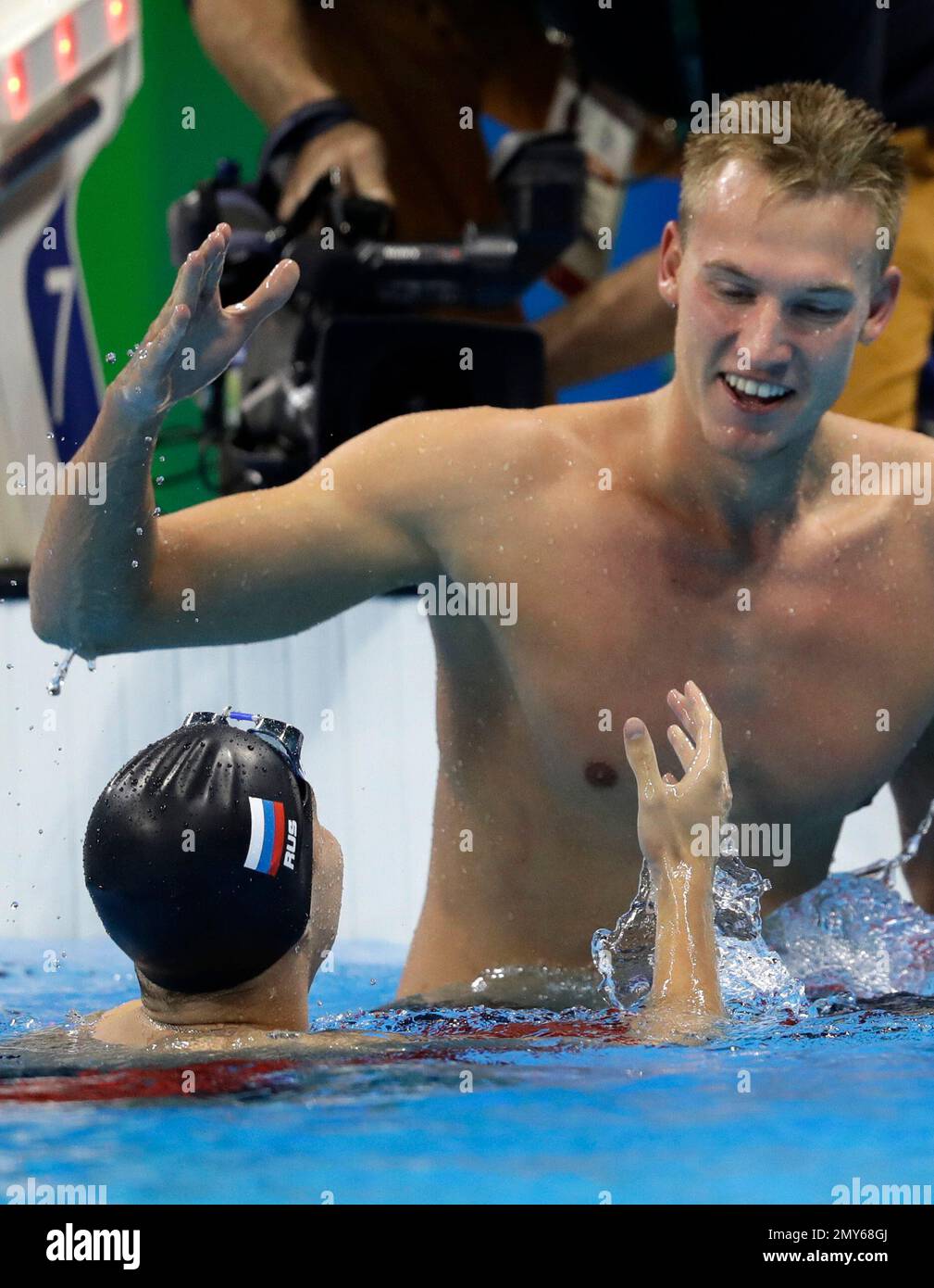 Kazakhstan's Dmitriy Balandin is congratulated by Russia's bronze medal ...