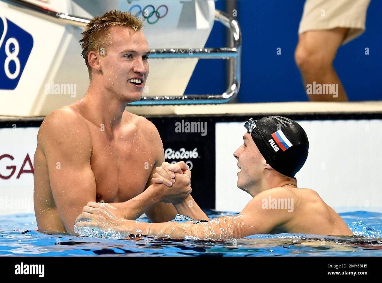 Kazakhstan's Dmitriy Balandin, left, celebrates after winning the gold ...