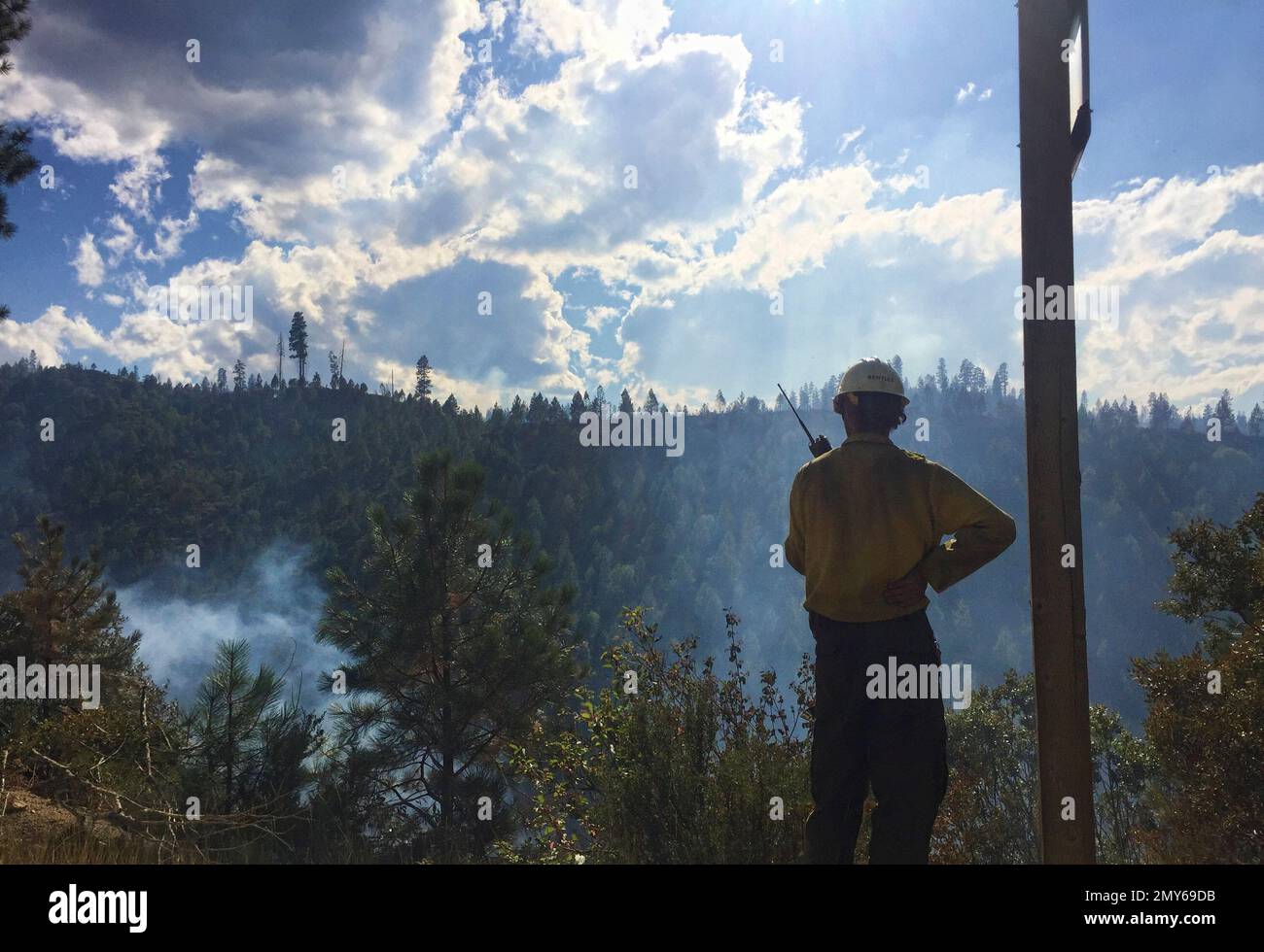 This Tuesday, Aug. 9, 2016 photo shows a firefighter communicating on a ...
