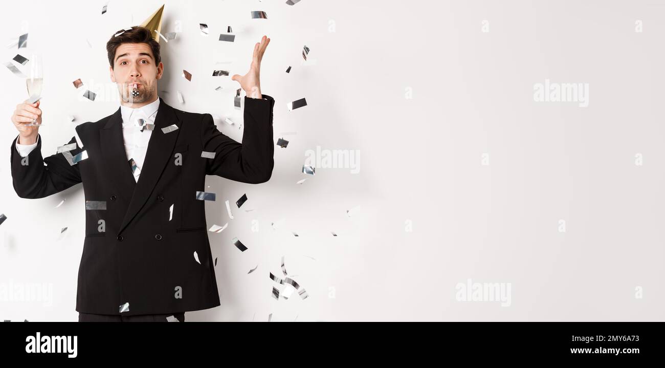 Handsome party guy in black suit having fun, celebrating new year ...