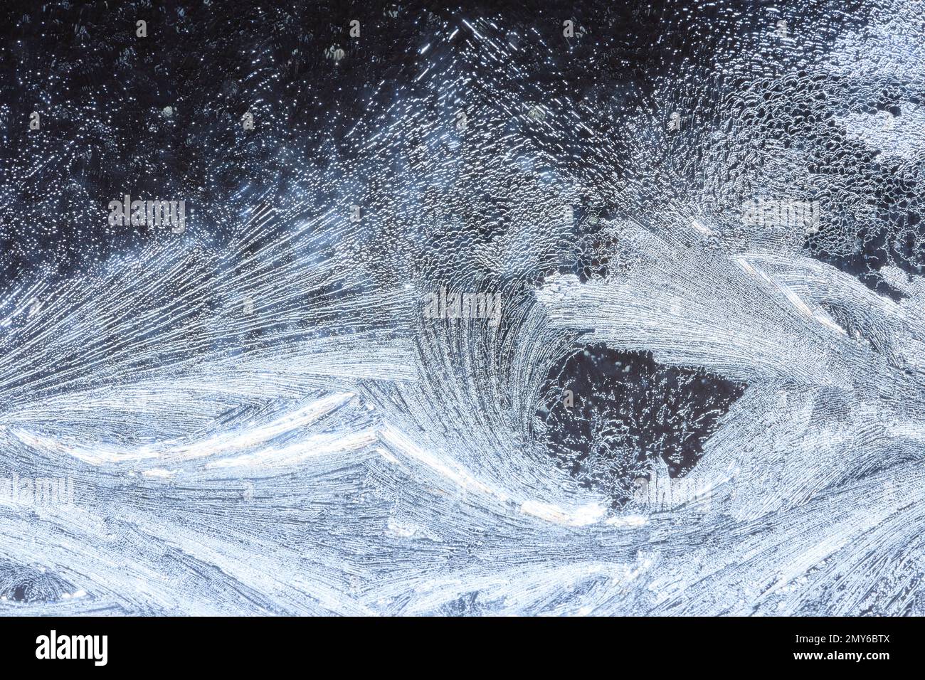 The ice flowers on the window Stock Photo - Alamy