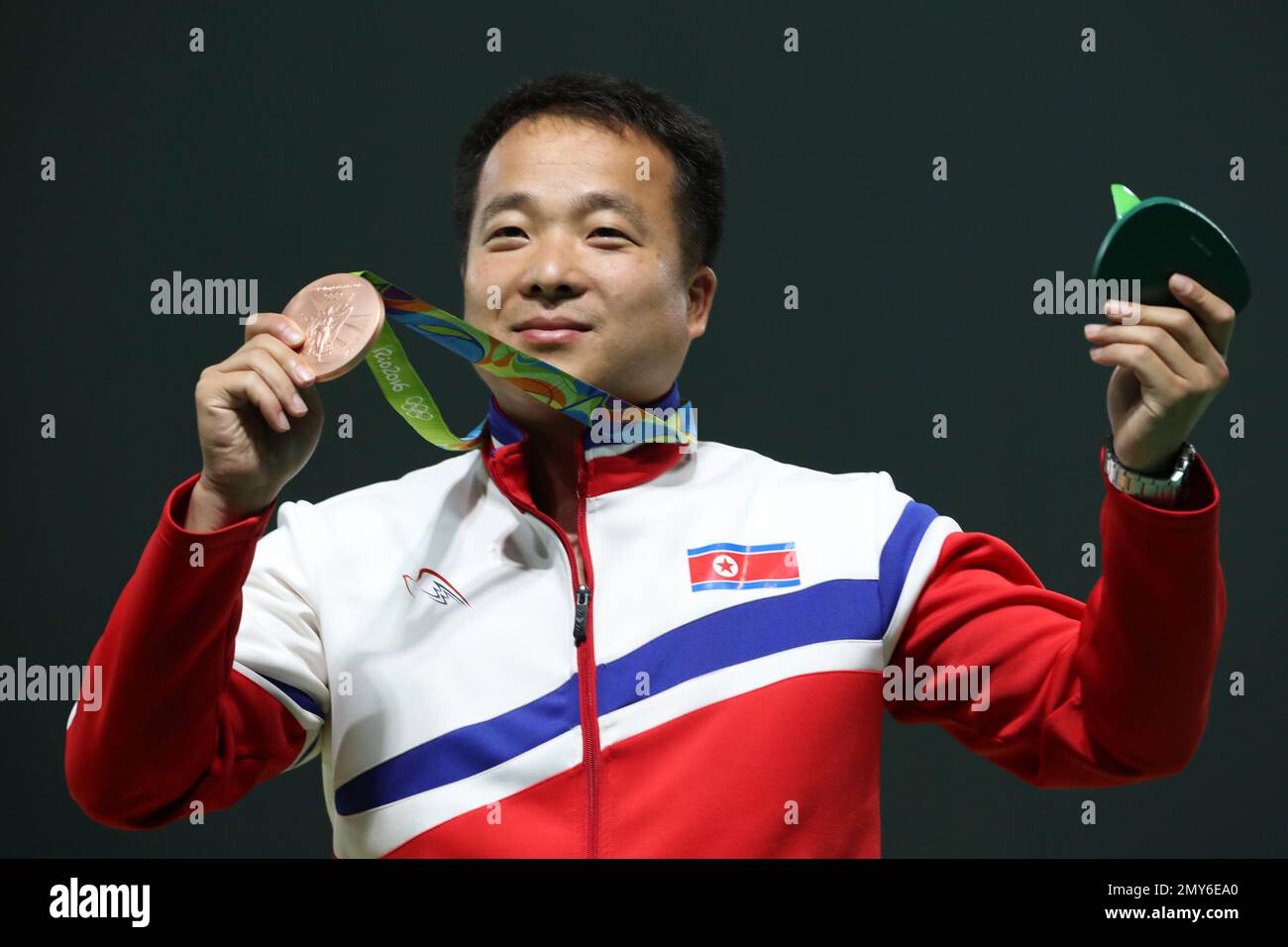 Kim Song Guk of North Korea celebrates his bronze medal during the ...