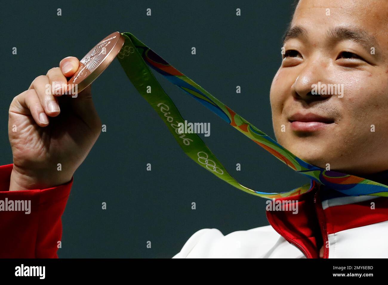 Bronze medalist Kim Song Guk of North Korea displays his medal during ...