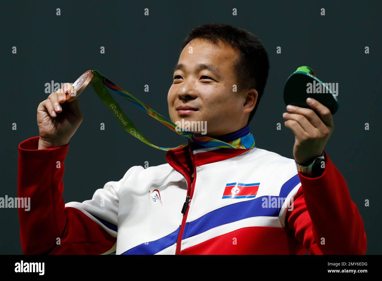 Bronze medalist Kim Song Guk of North Korea displays his medal during ...