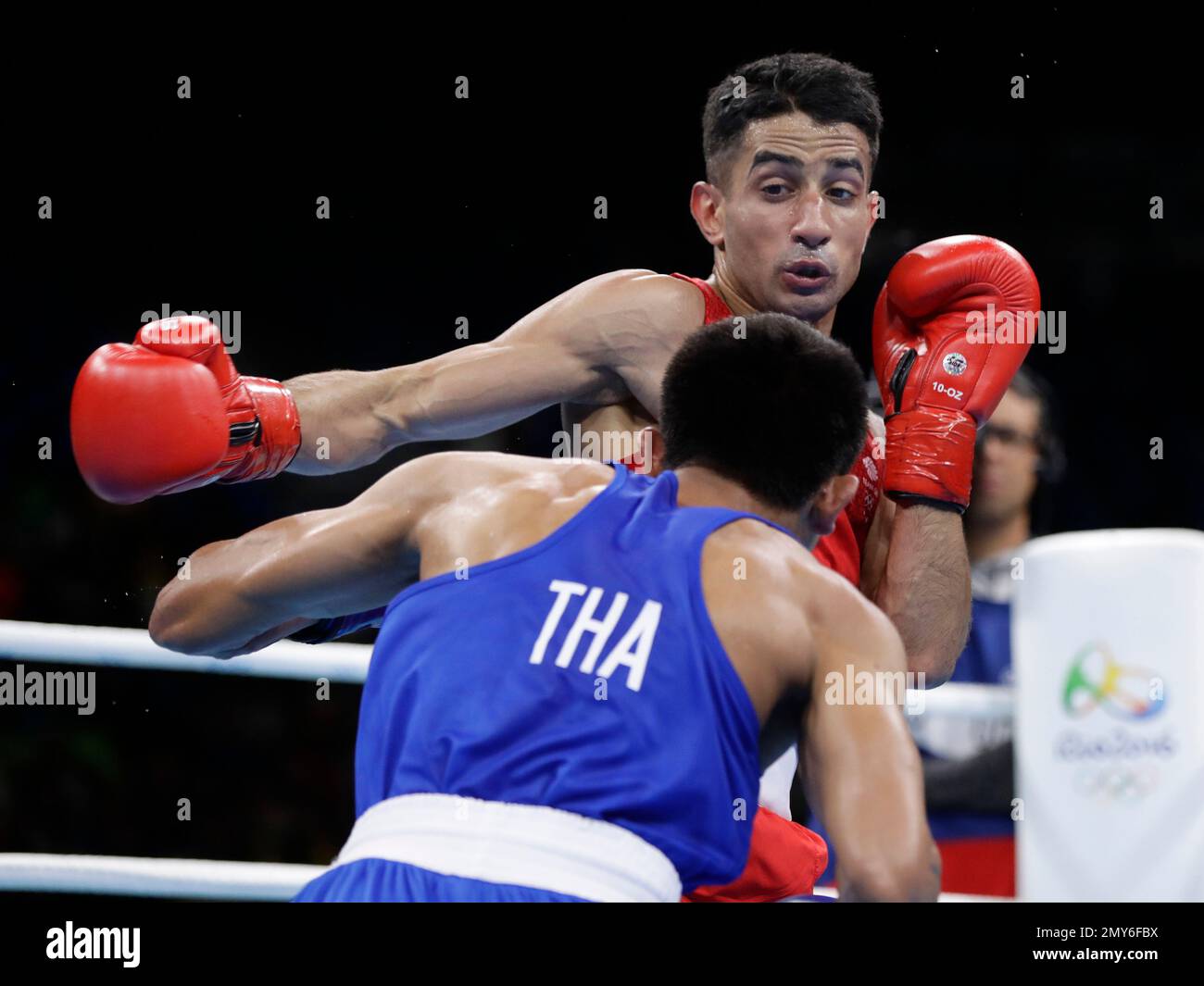 Britain's Qais Ashfaq fights Thailand's Chatchai Butdee during a men's ...