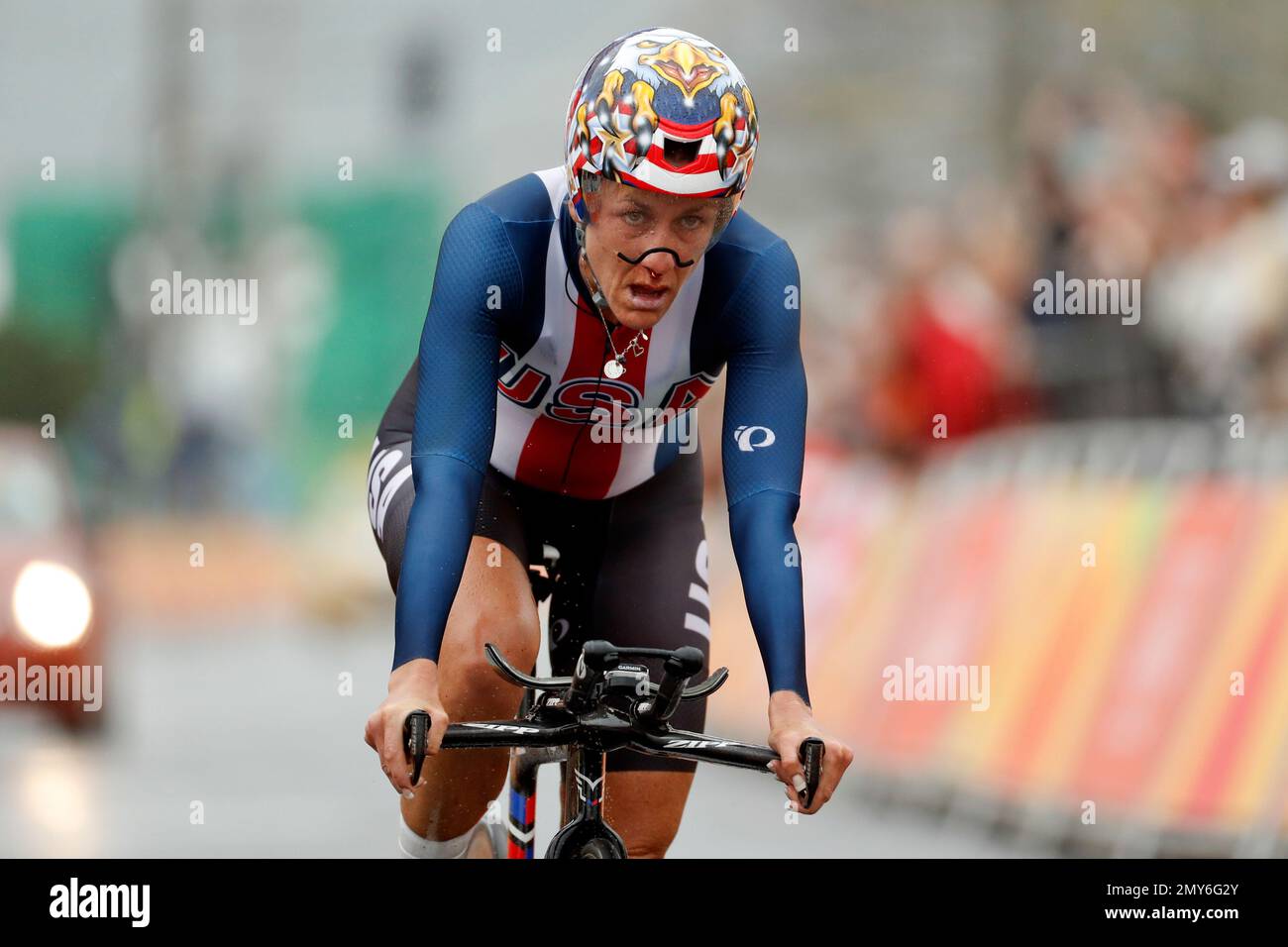 Cyclist Kristin Armstrong of the United States crosses the finish line ...