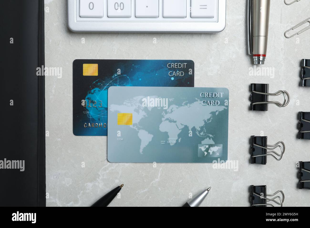 Flat lay composition with credit cards, calculator and stationery on ...
