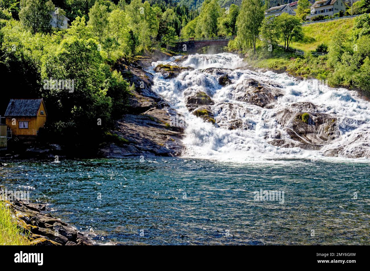 Hellesyltfossen - waterfall rushing at Hellesylt on the Geiranger fjord ...