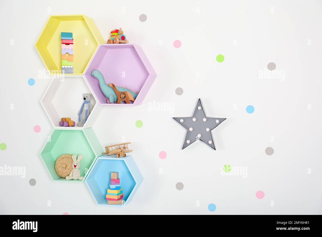 Bright colorful shelves on light wall. Interior design Stock Photo - Alamy