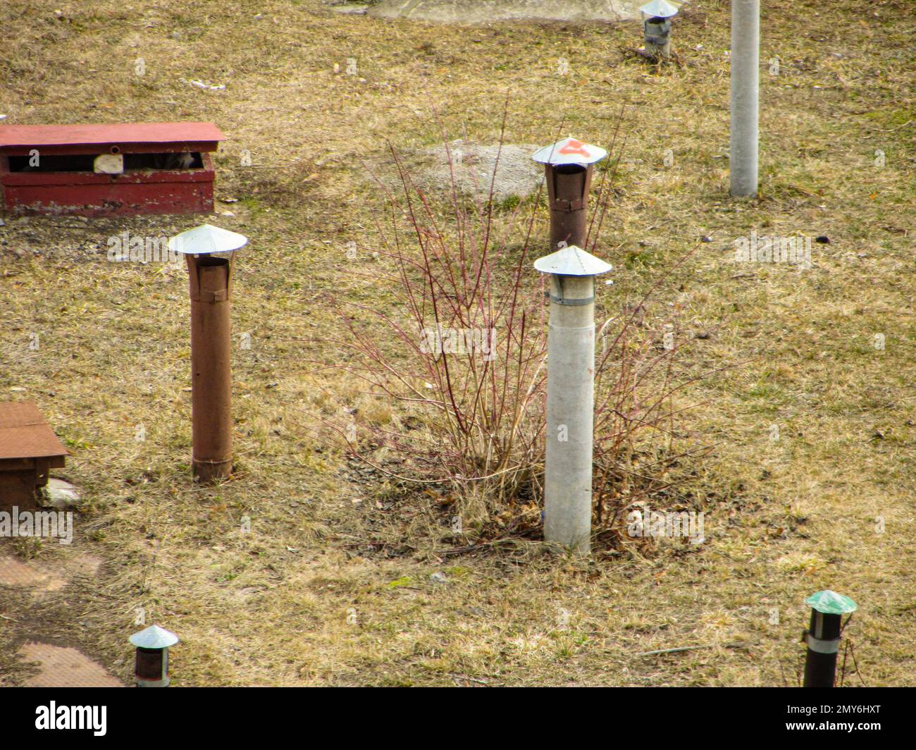 Vent pipe sticks out of the ground. Pipe ventilation of the cellar. A ...