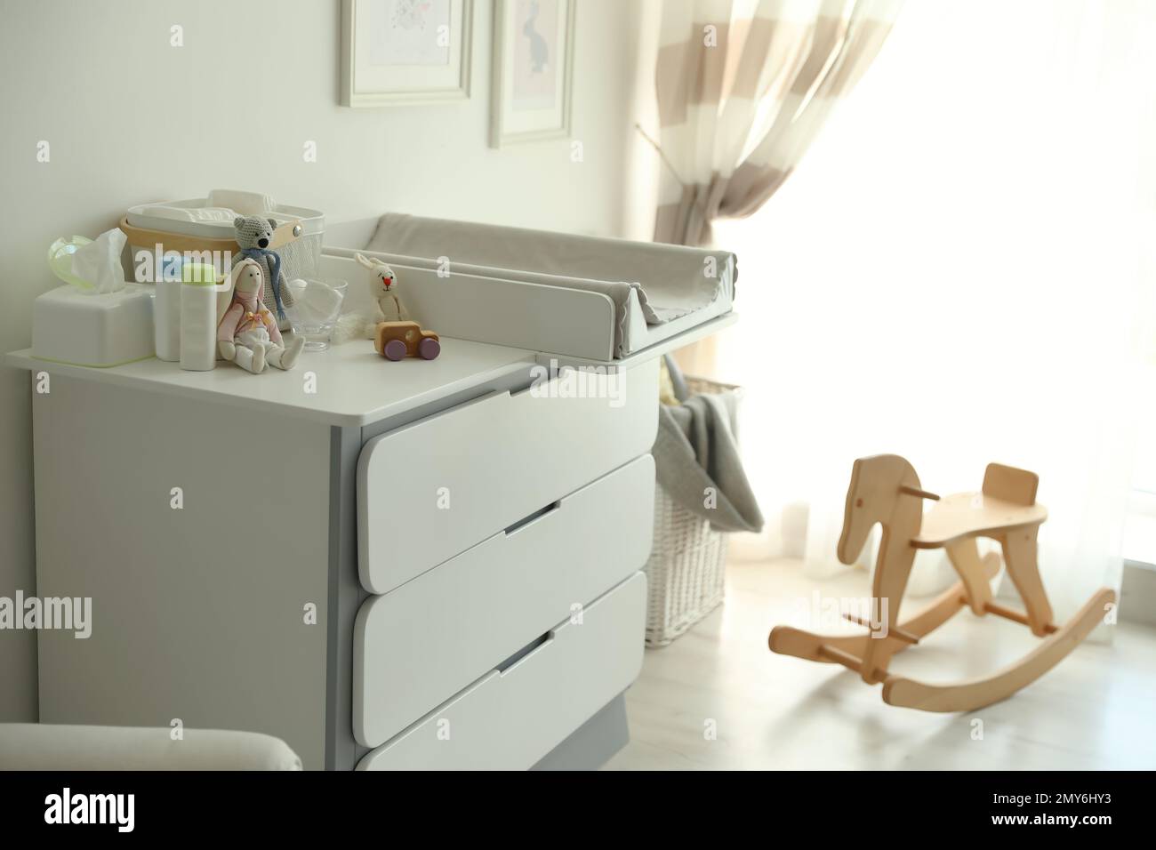 Modern changing table in baby room interior Stock Photo - Alamy