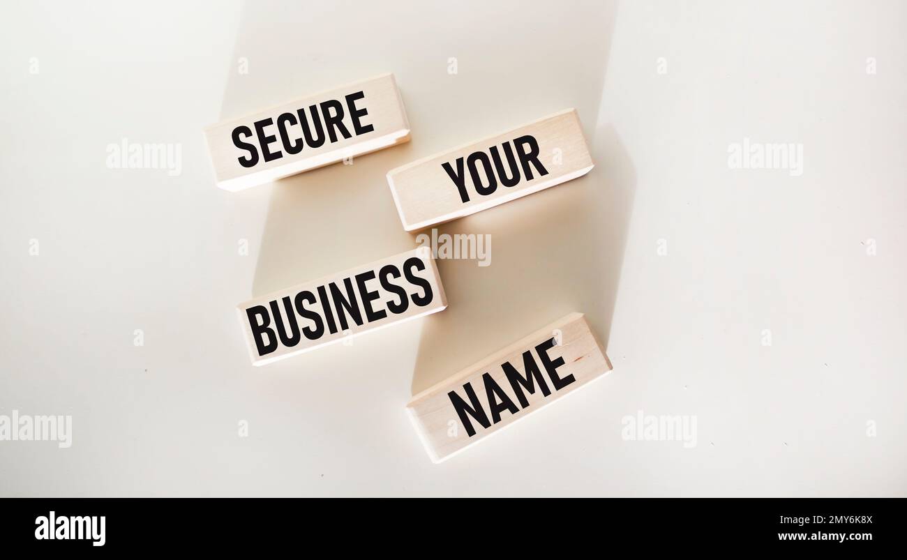 SECURE YOUR BUSINESS NAME text on wooden blocks and white background ... SECURE YOUR BUSINESS NAME text on wooden blocks and white background ...