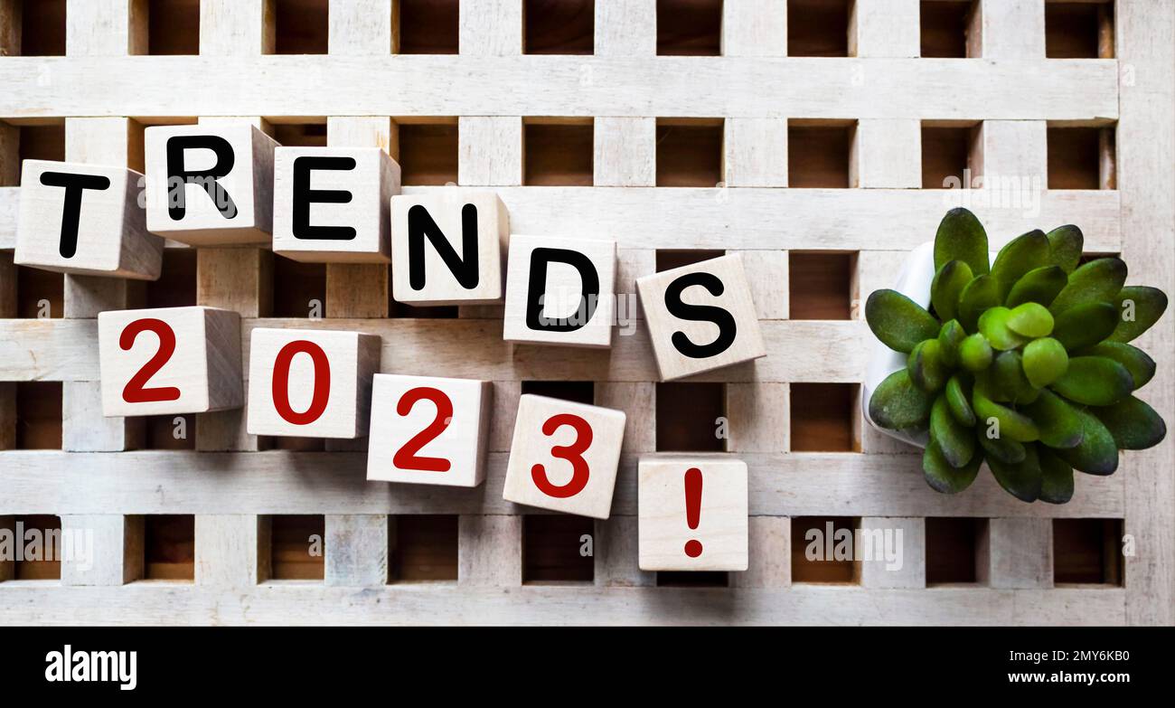 2023 trend concept, vintage background. On wooden cubes, the trend of ...