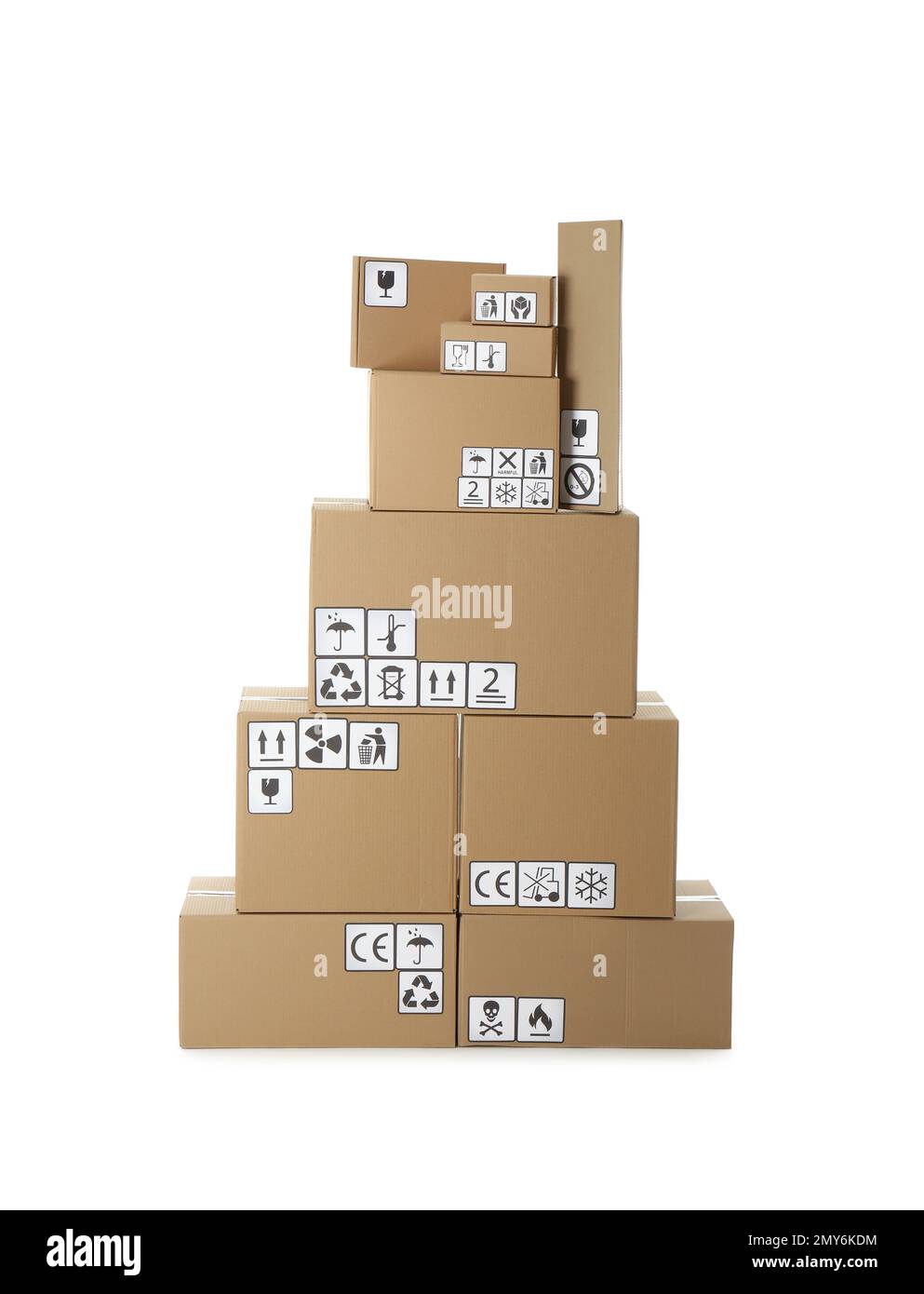 Stack of cardboard boxes with different packaging symbols on white ...