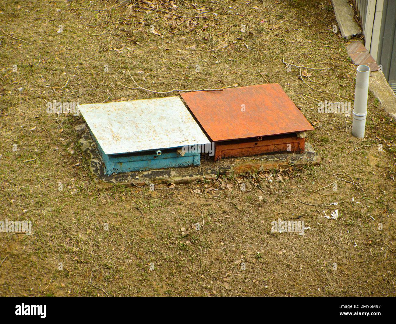 Vent pipe sticks out of the ground. Pipe ventilation of the cellar. A ...