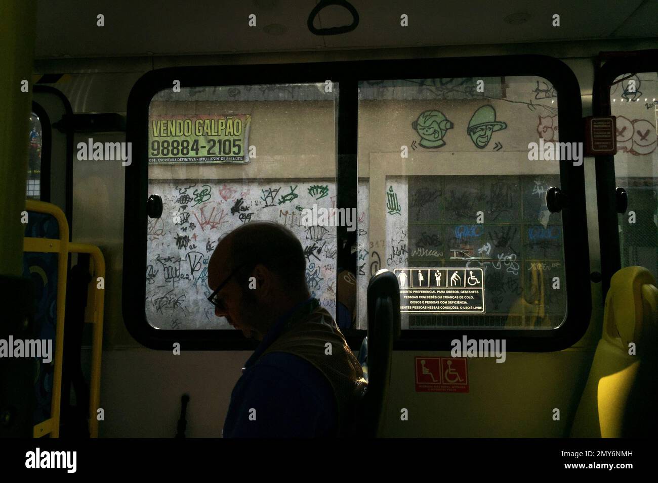 A journalist sits in a shuttle bus en route to the Whitewater Stadium ...