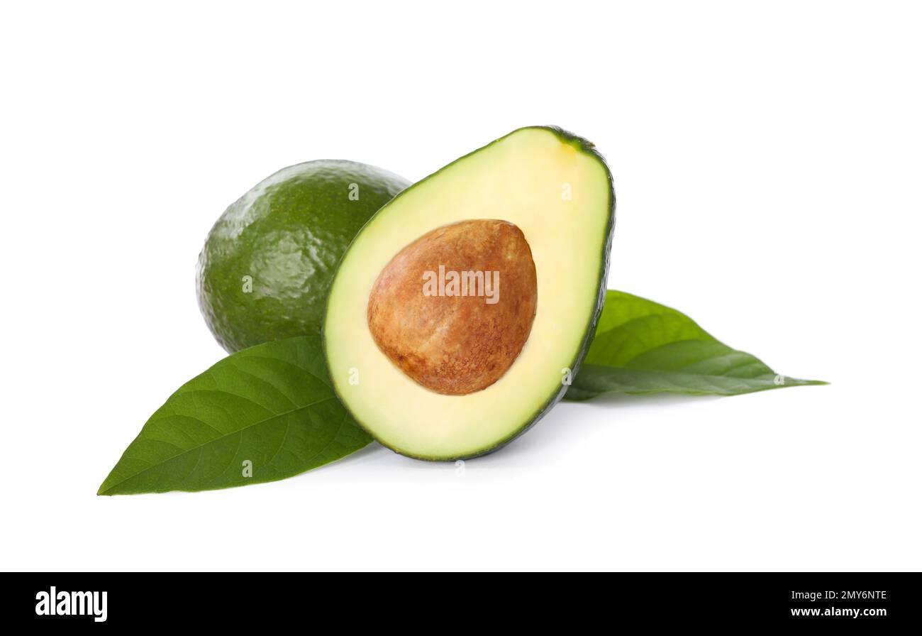 Whole and cut avocados isolated on white Stock Photo - Alamy