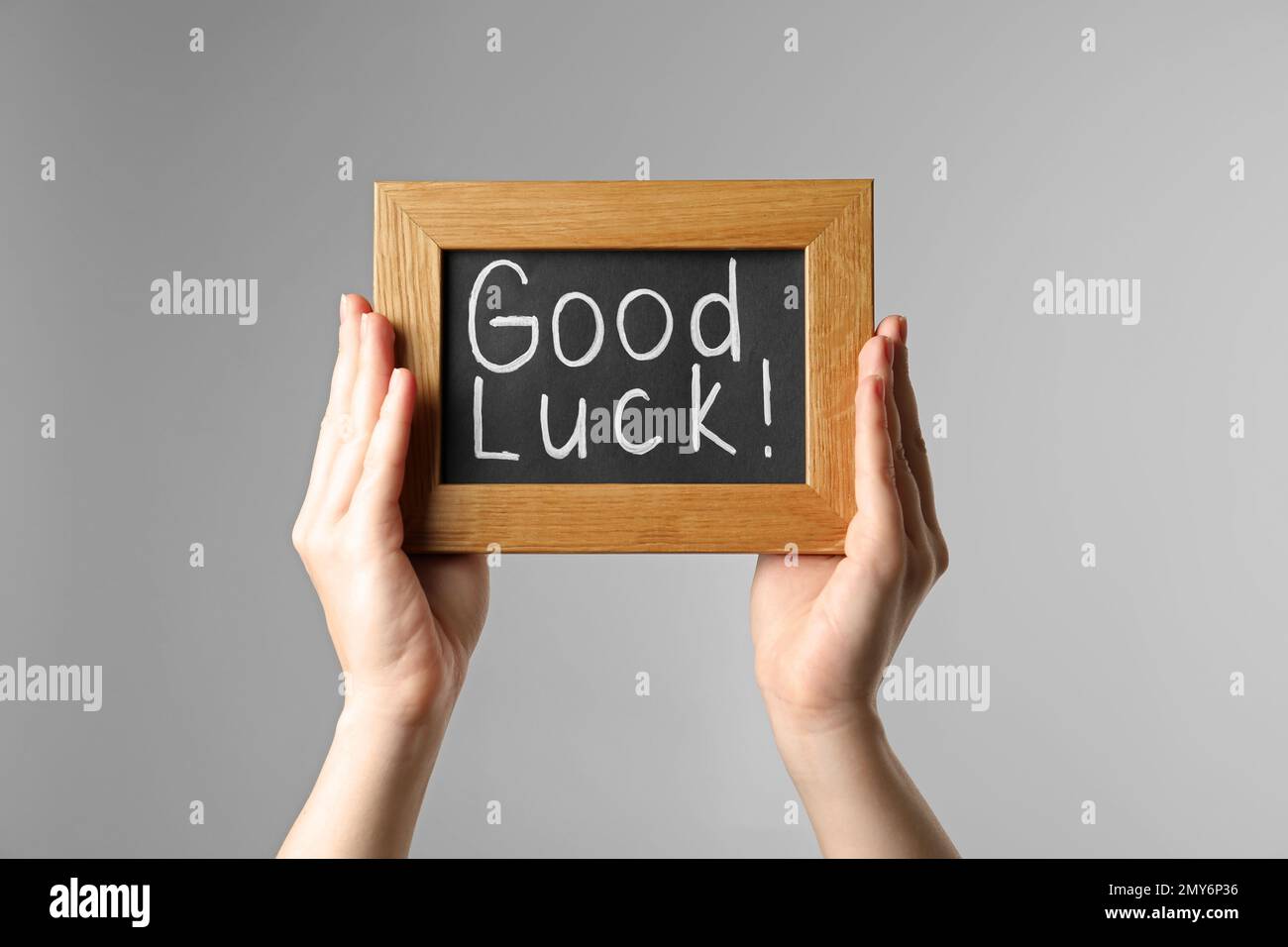 Happy woman good luck sign hi-res stock photography and images - Alamy