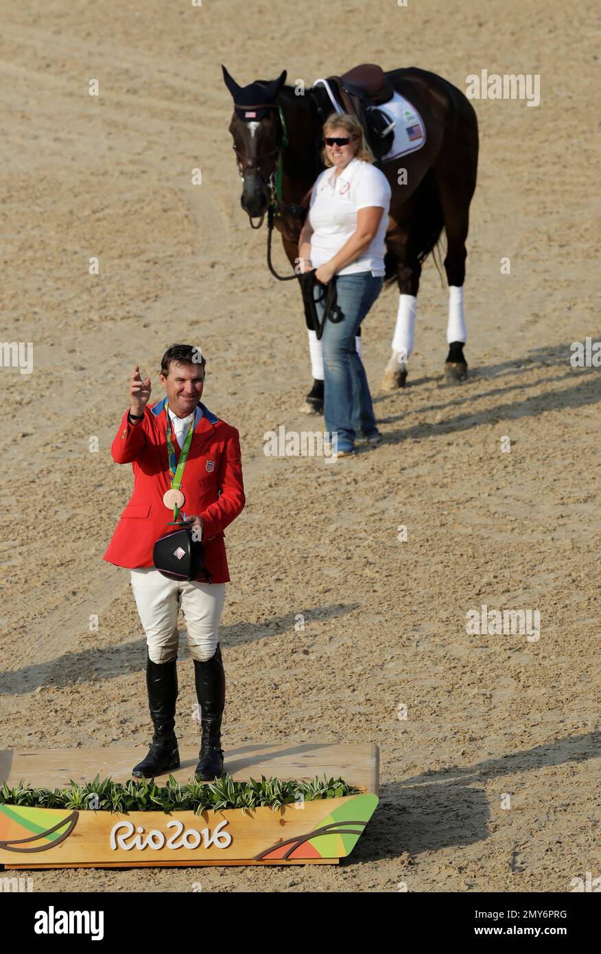 Phillip Dutton, of the United States, acknowledges applause after being ...