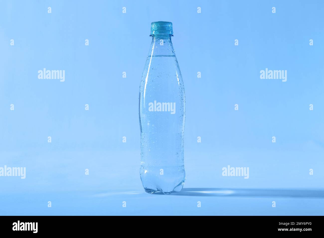 Plastic bottle of pure water on color background Stock Photo - Alamy