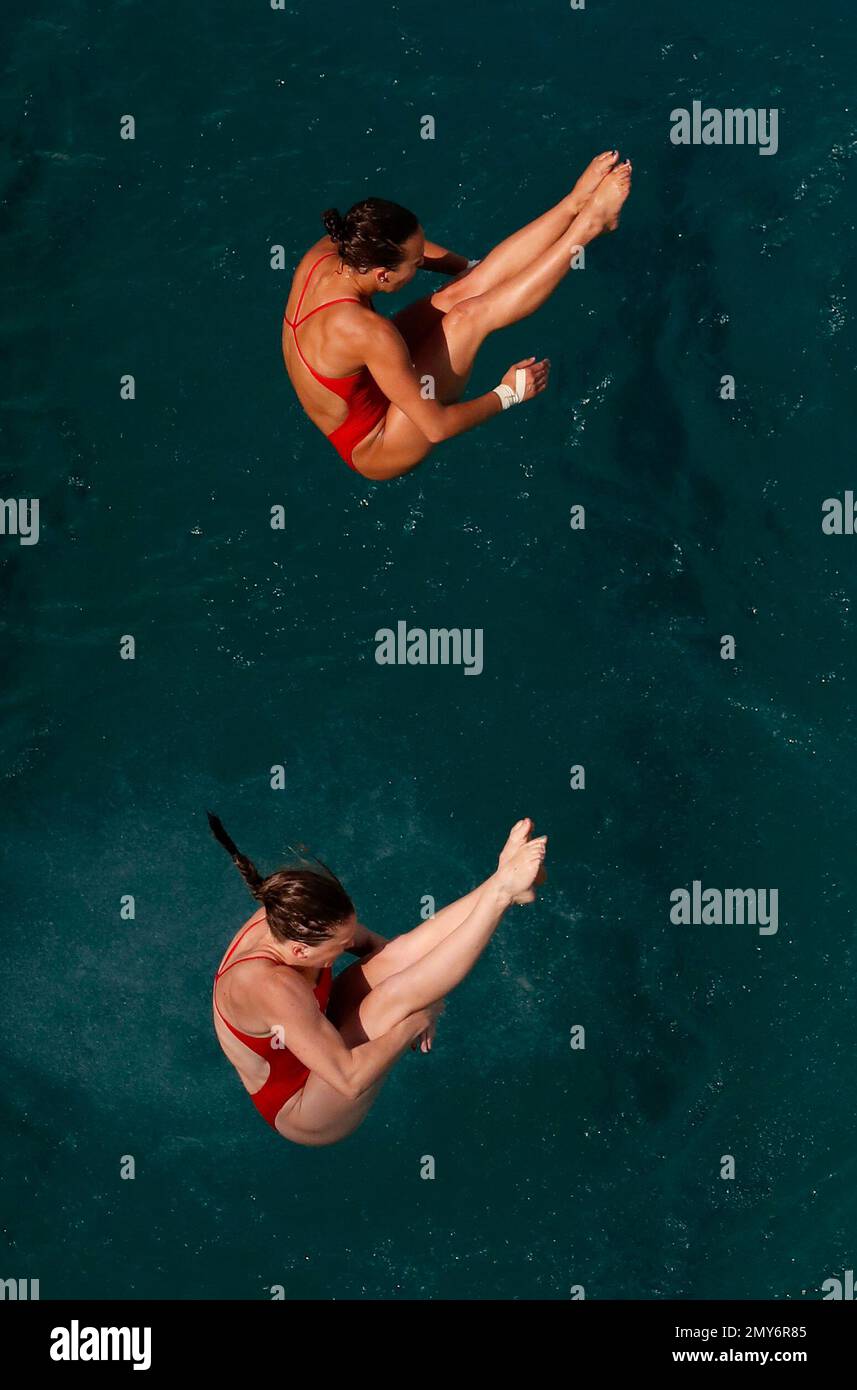 United States' Amy Cozad, bottom, and Jessica Parratto perform a ...