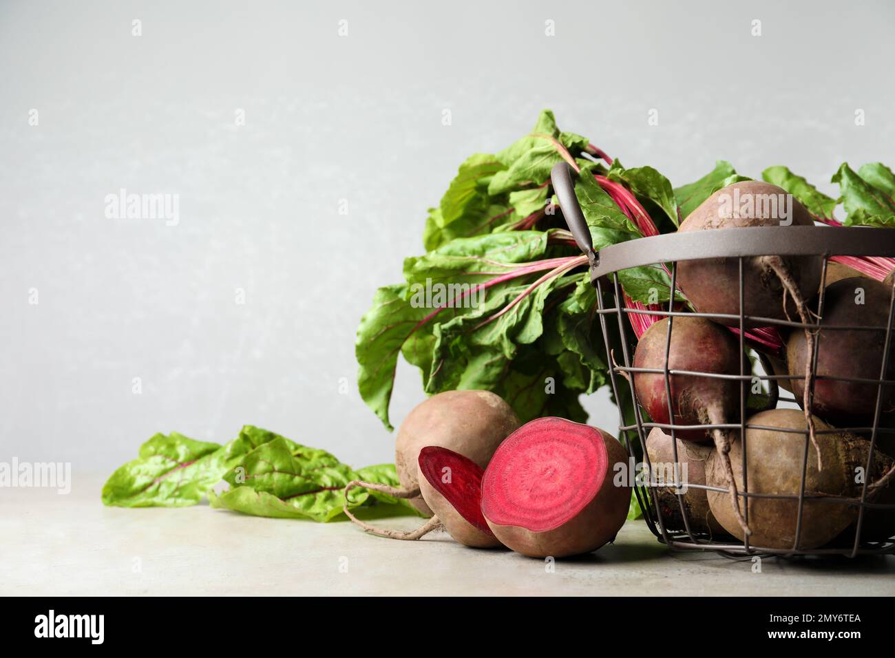 Fresh ripe beets on light grey table Stock Photo - Alamy