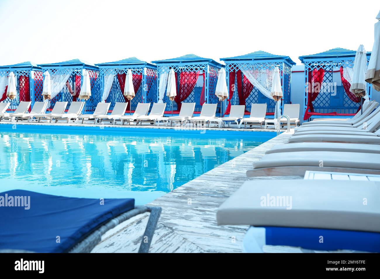 Swimming pool sunbeds resort on hi-res stock photography and images - Alamy