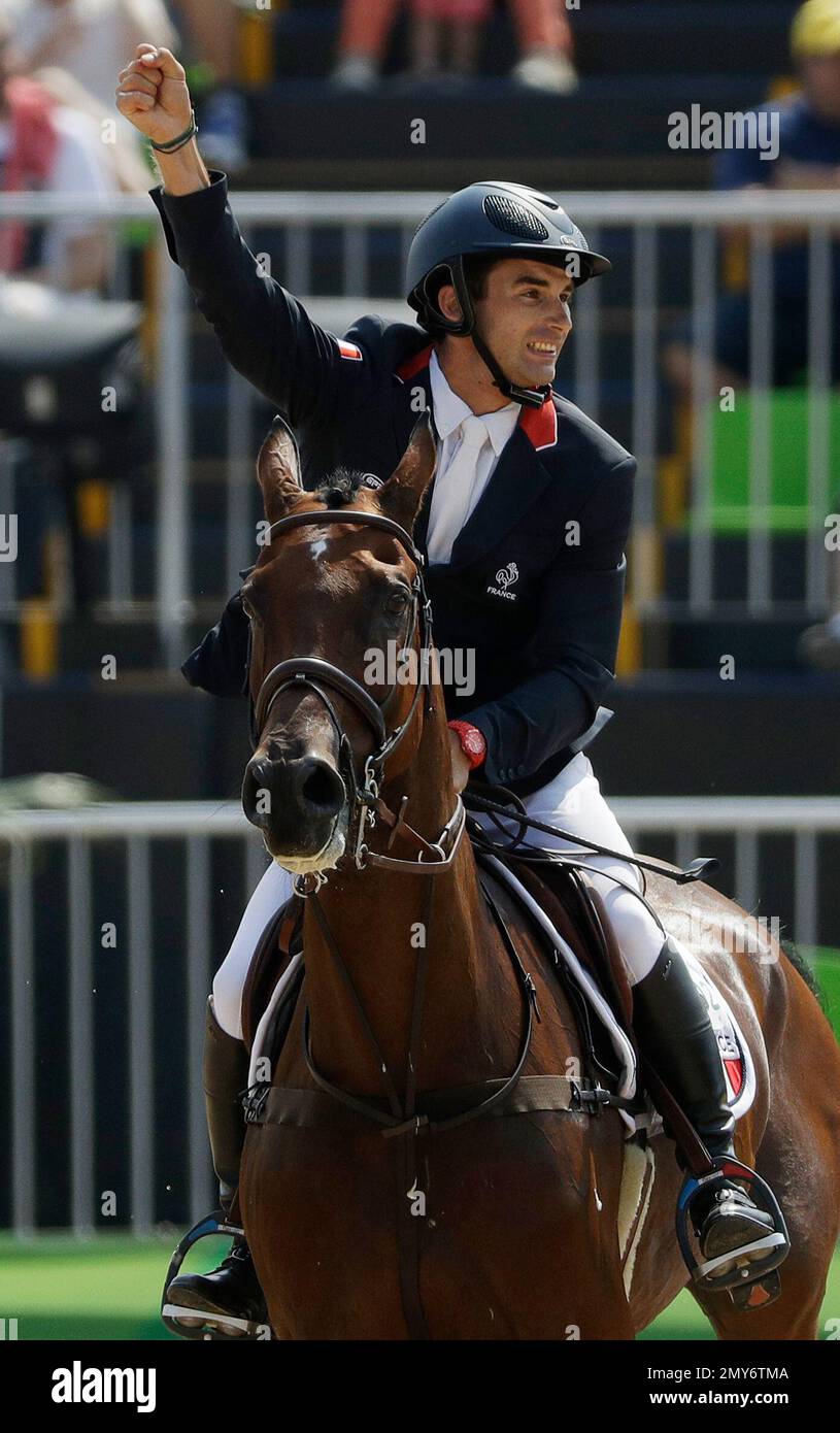 Astier Nicolas, of France, riding Piafde B'Neville, celebrates after ...
