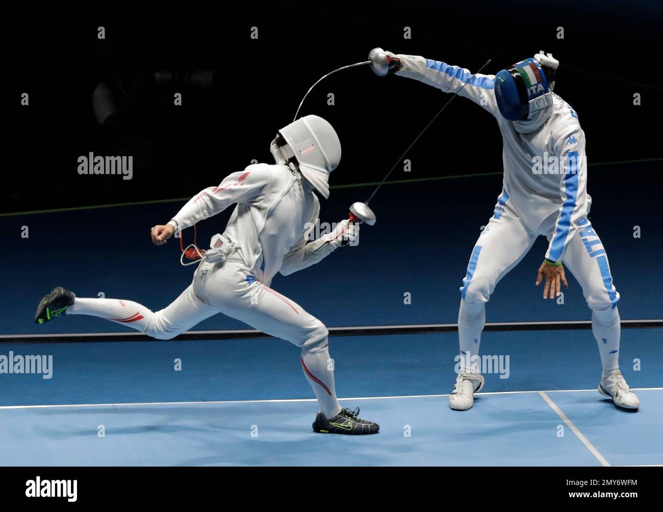 Minobe Kazuyasu of Japan, left, and Marco Fichera of Italy compete in ...