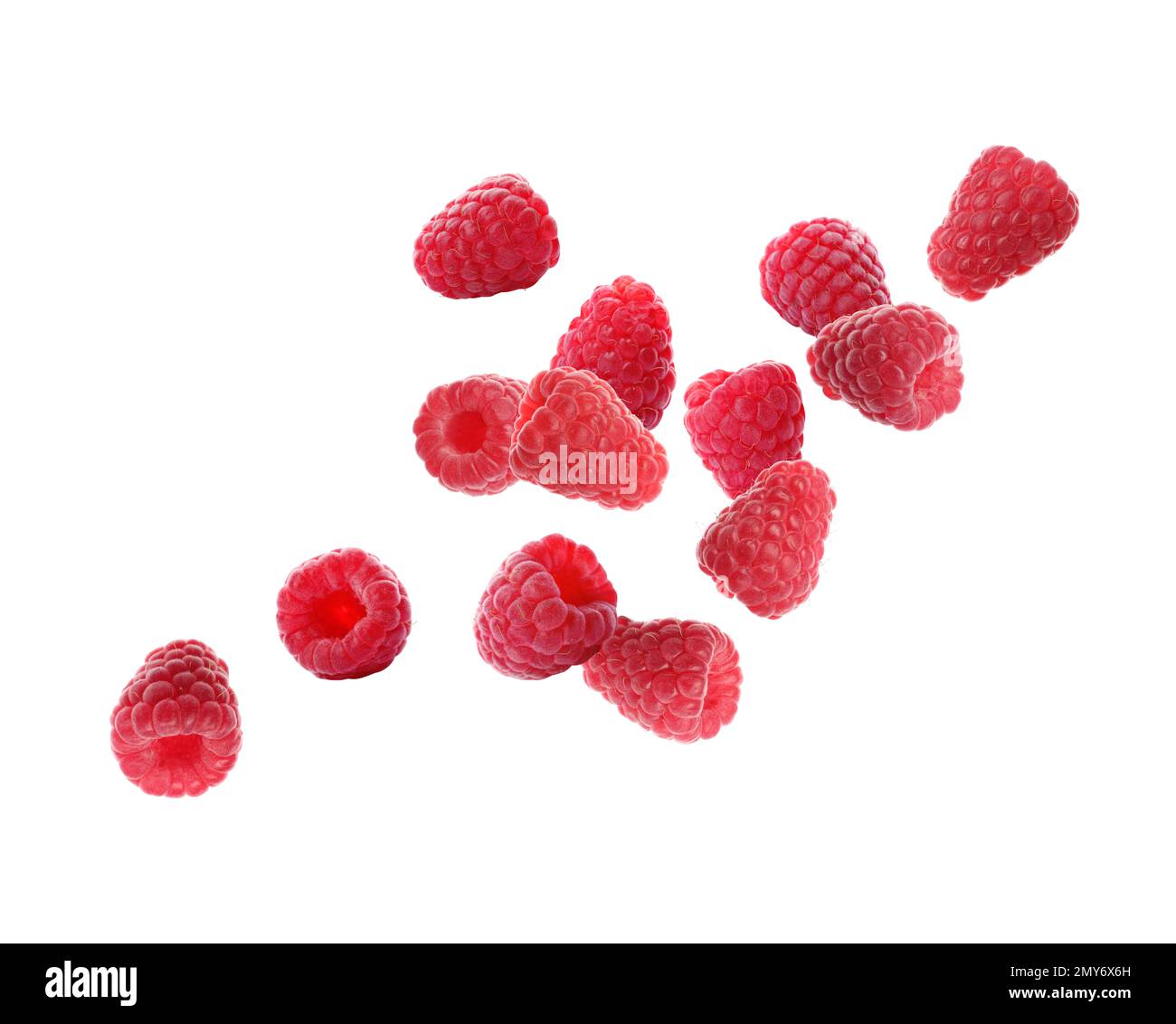 Fresh ripe raspberries flying on white background Stock Photo - Alamy