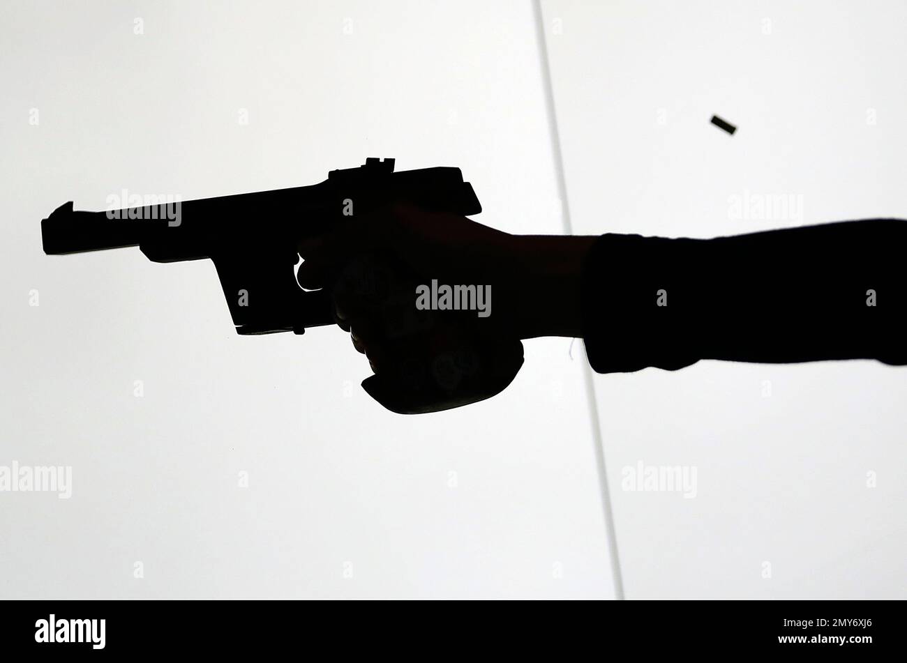 An athlete competes during the women's 25 meter pistol qualification ...